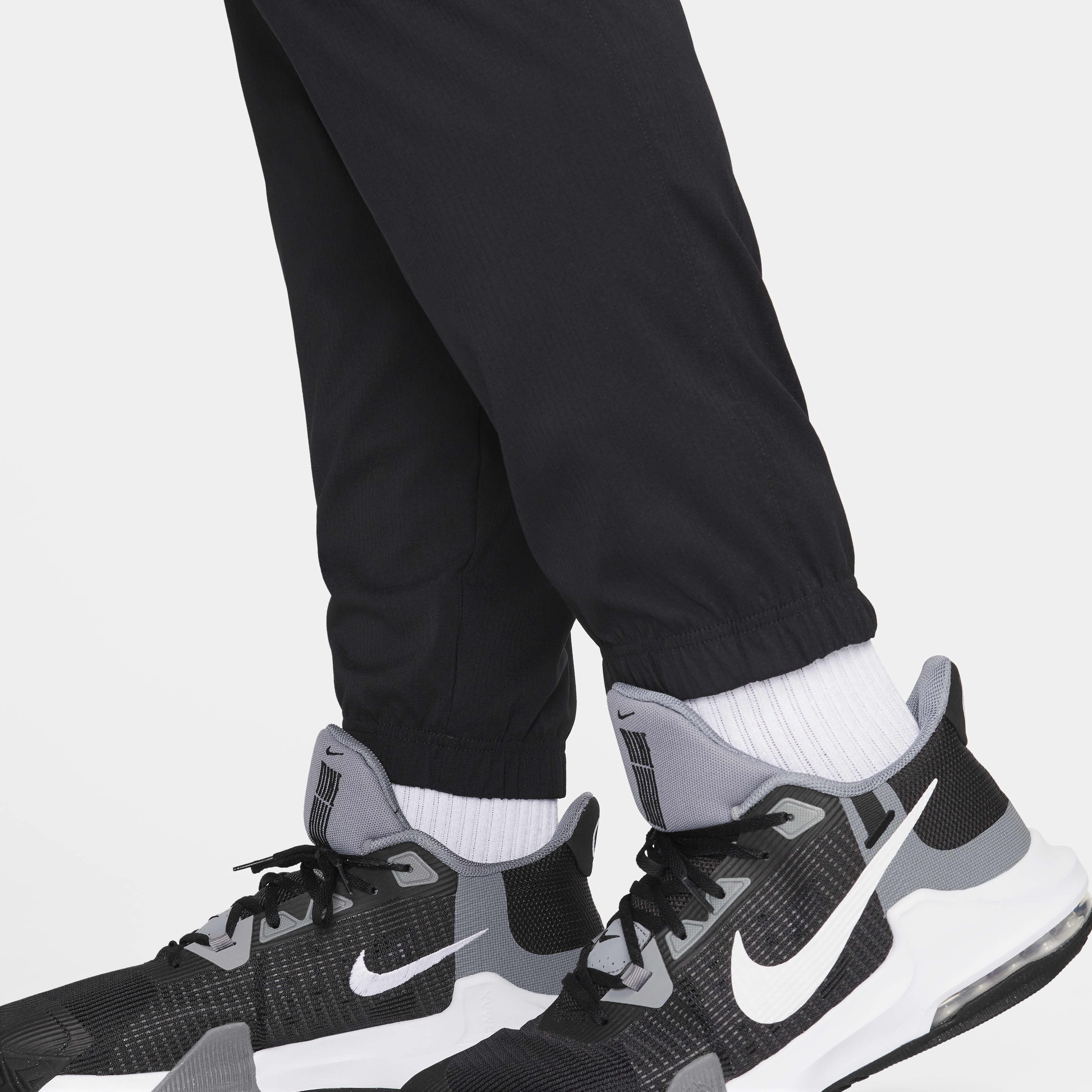 Buy Nike DNA Men's Woven Basketball Trousers - Black/White @ Nike UAE