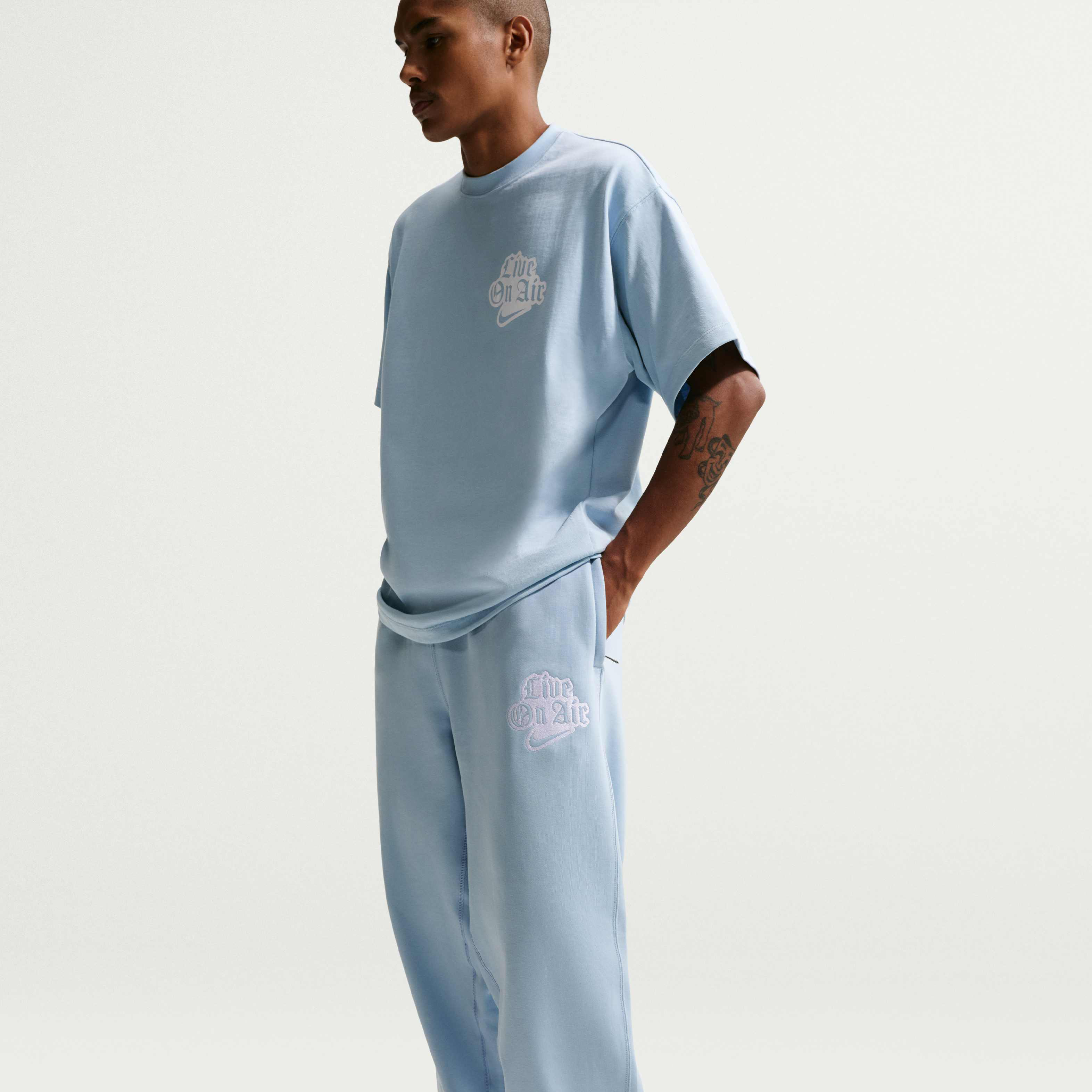 Buy Nike Solo Swoosh Men's Cuffed Fleece Trousers - Light Armoury Blue ...