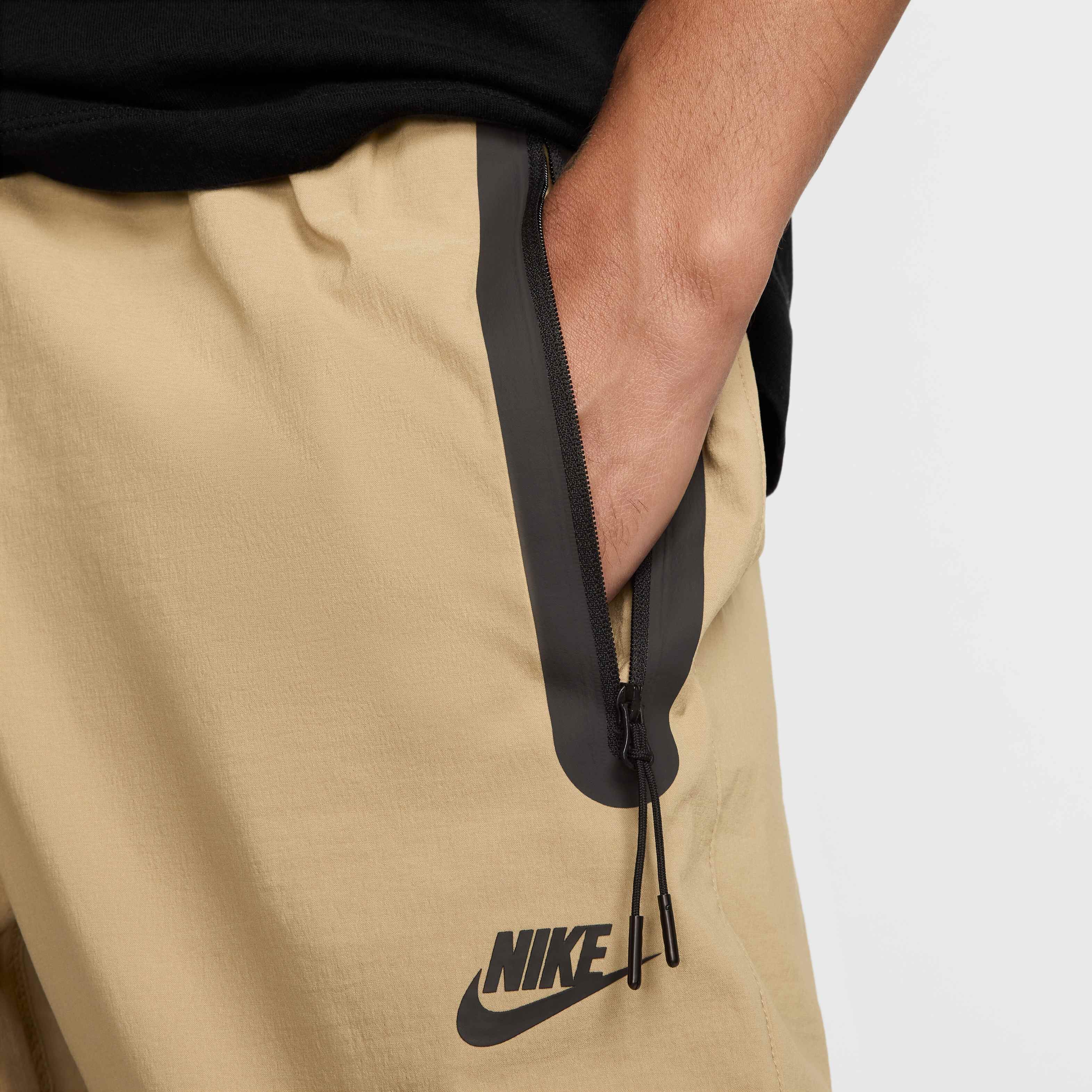 Buy Nike Tech Men's Woven Trousers - Parachute Beige/Black @ Nike UAE