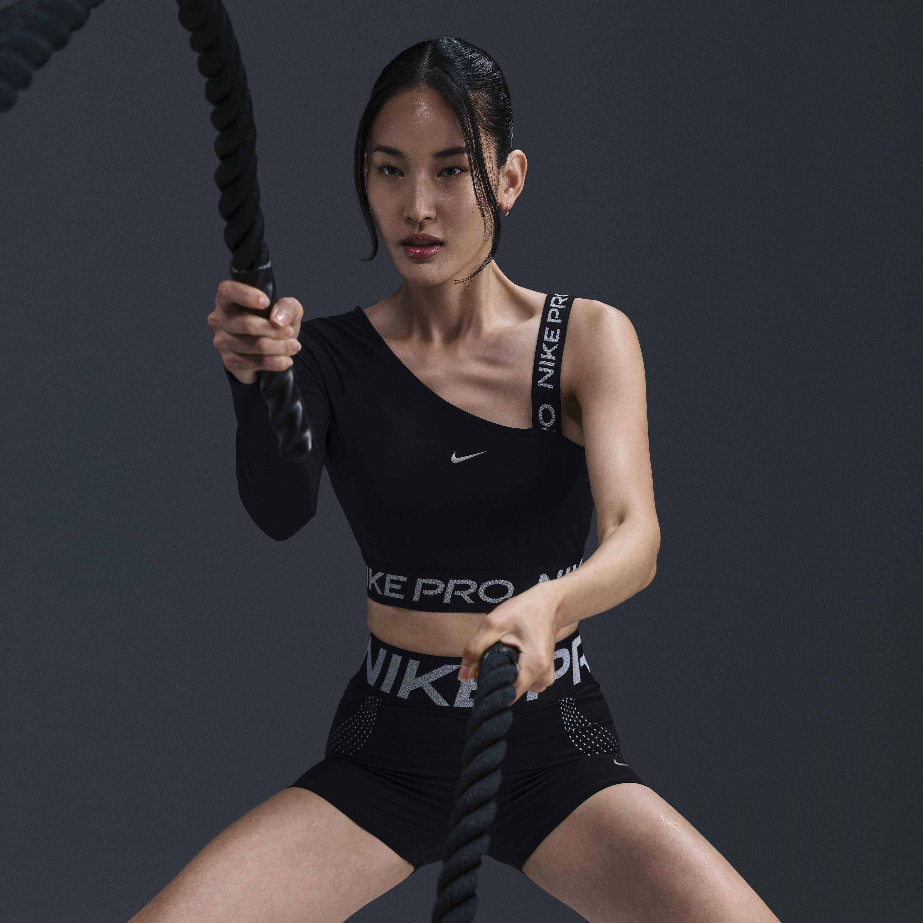 Buy Nike Pro Shine Women's Dri-FIT Asymmetrical Cropped Top - Black ...