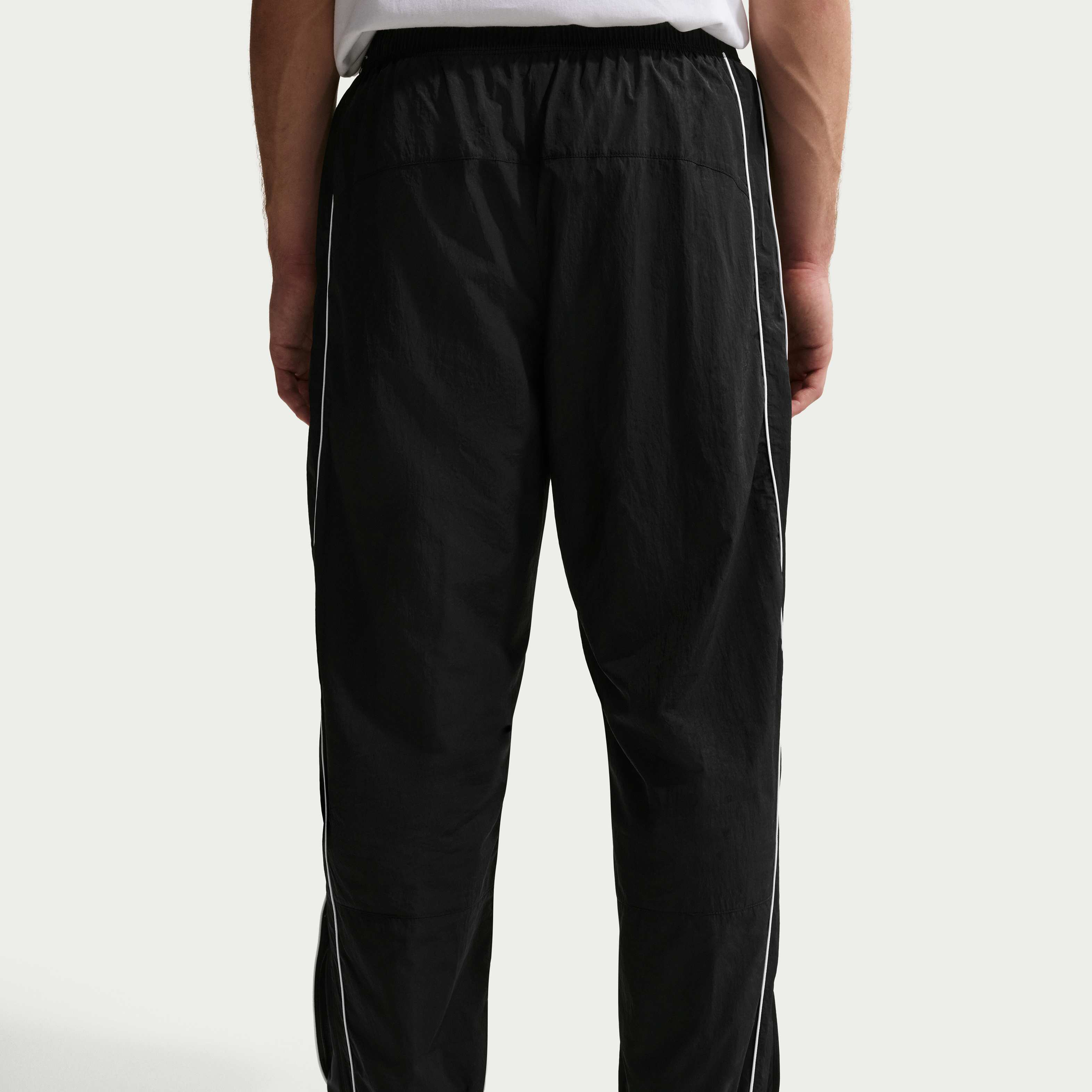 Buy Nike Sportswear Men's Woven Pants - Black/Black/Black @ Nike UAE