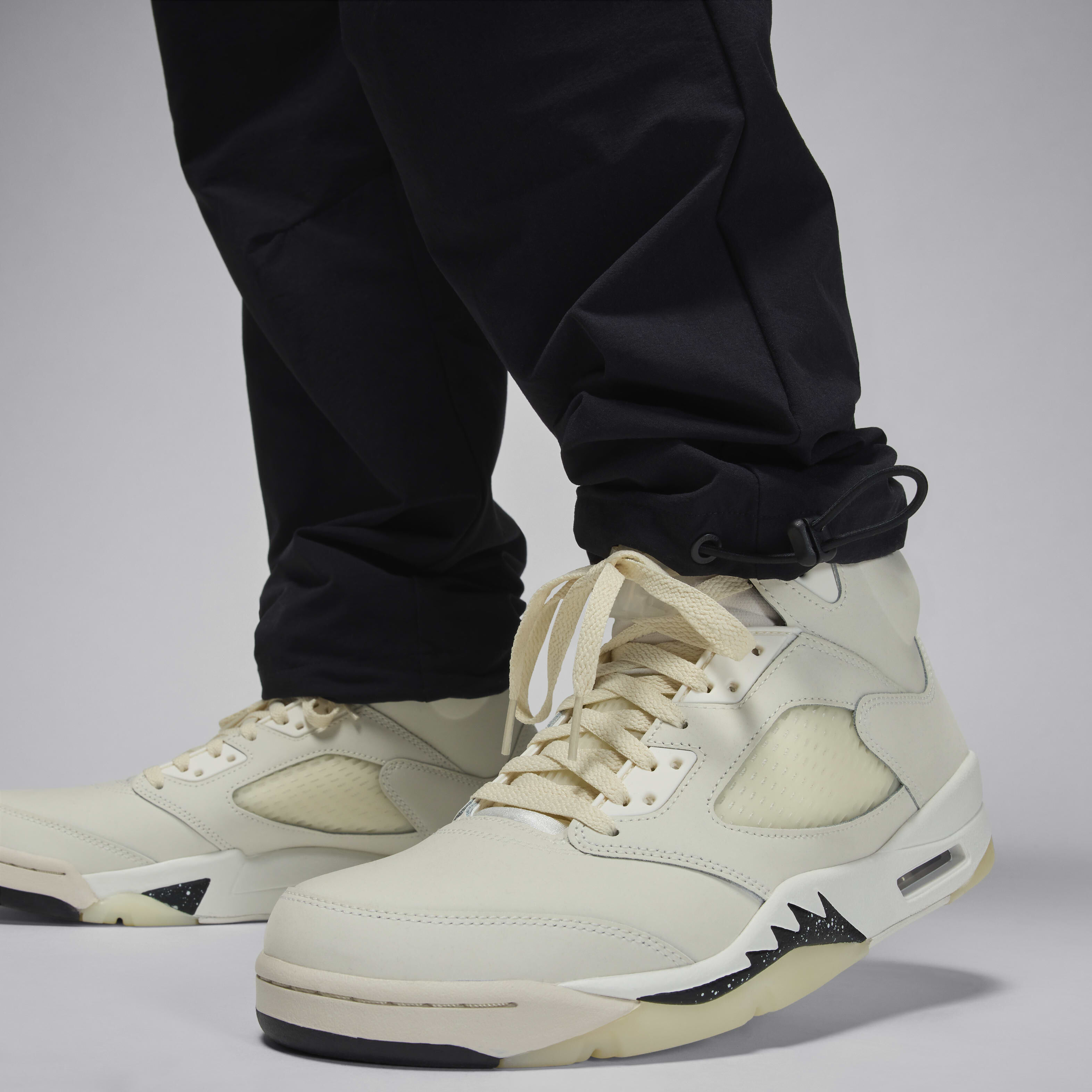 Buy Jordan Essential Men's Woven Trousers - Black/White @ Nike UAE